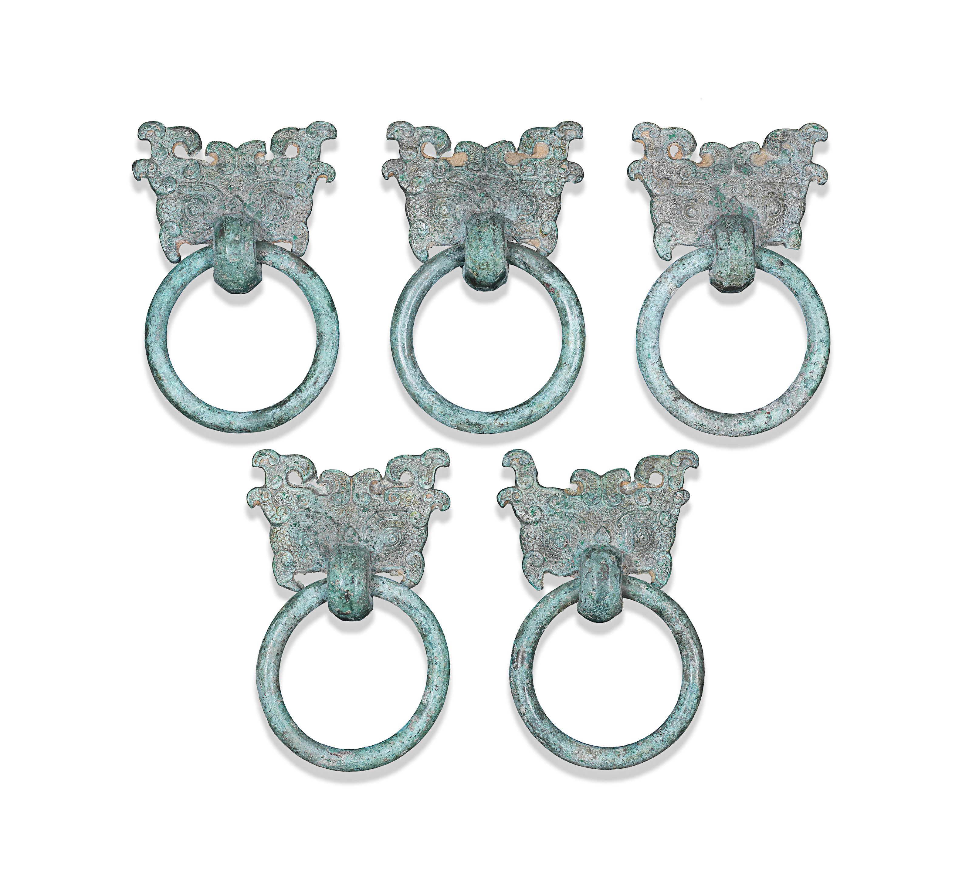 Bonhams : A set of five archaic bronze 'Taotie mask' ring handles ...