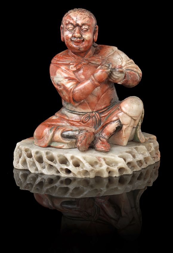 Bonhams : A soapstone carving of a seated luohan 17th/18th century