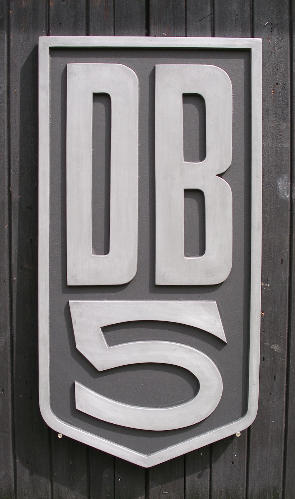 Bonhams Cars : An Aston Martin 'DB5' garage display emblem,