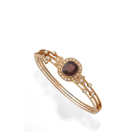 Bonhams : A garnet and seed pearl bangle, circa 1900