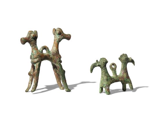 Bonhams : Two Luristan bronze double-headed pendants