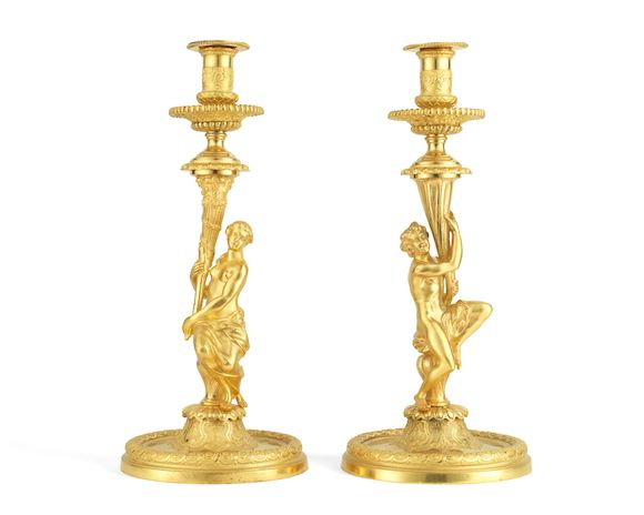 Bonhams : A pair of gilt bronze Régence style figural candlesticks in ...