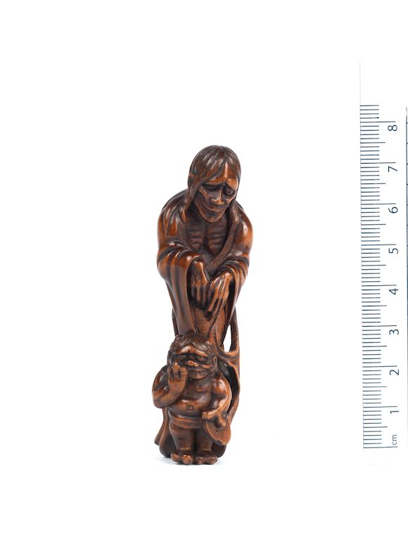 Bonhams : A wood netsuke of the ghost of a woman 19th century