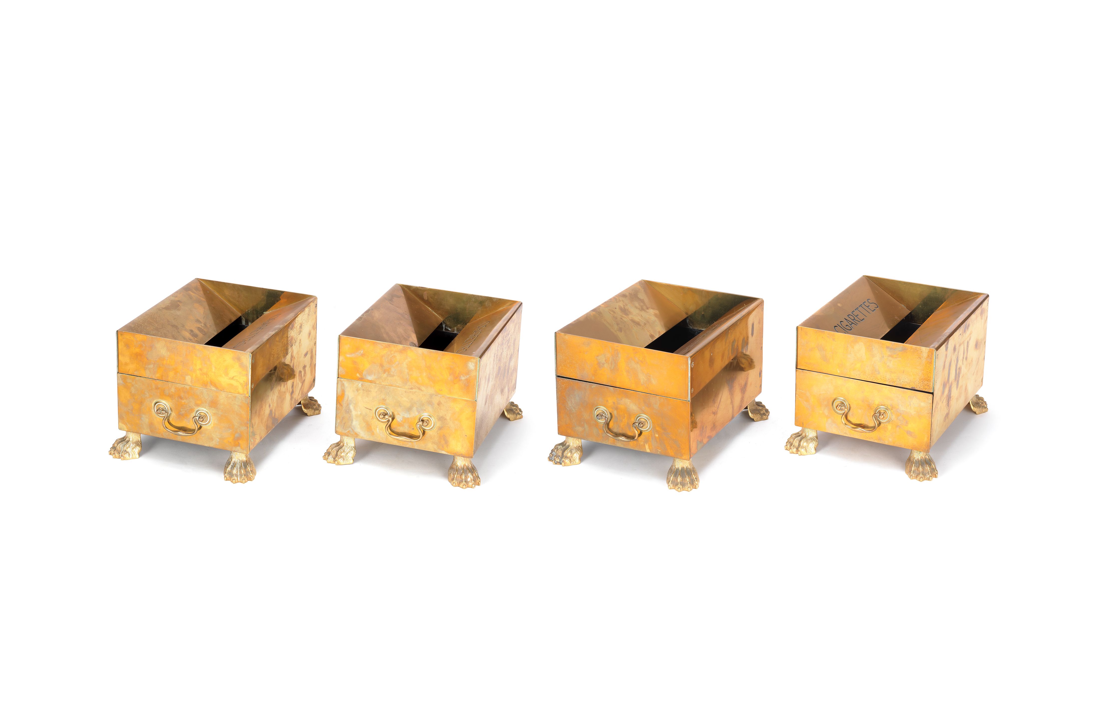 Bonhams : A set of four brass floor-standing cigarette ash boxes ...