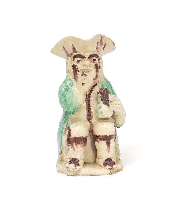 Bonhams : A creamware 'Step' Toby jug, circa 1780-85