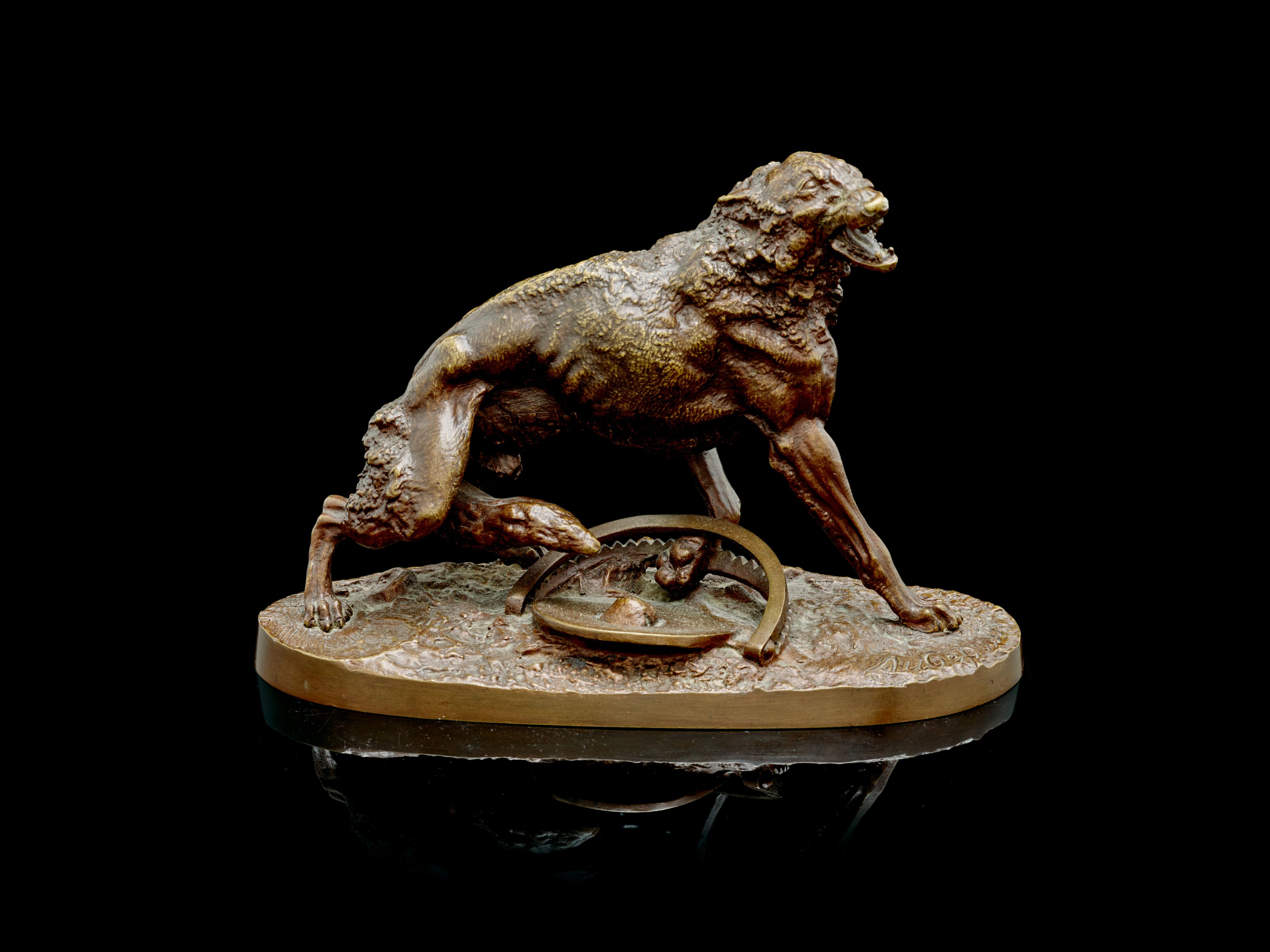Bonhams : A bronze model of a wolf caught in a trap after model by ...