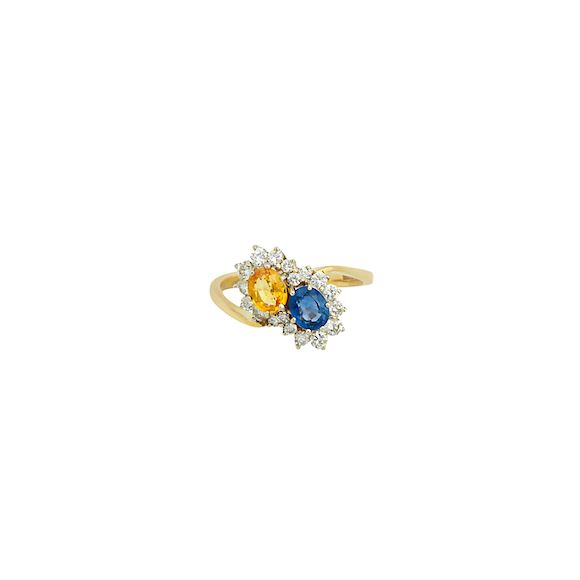 Bonhams : A blue and yellow sapphire and diamond cluster ring, retailed ...