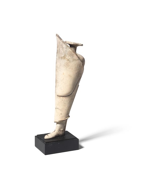 Bonhams : An East Greek plastic vase in the form of a greaved leg