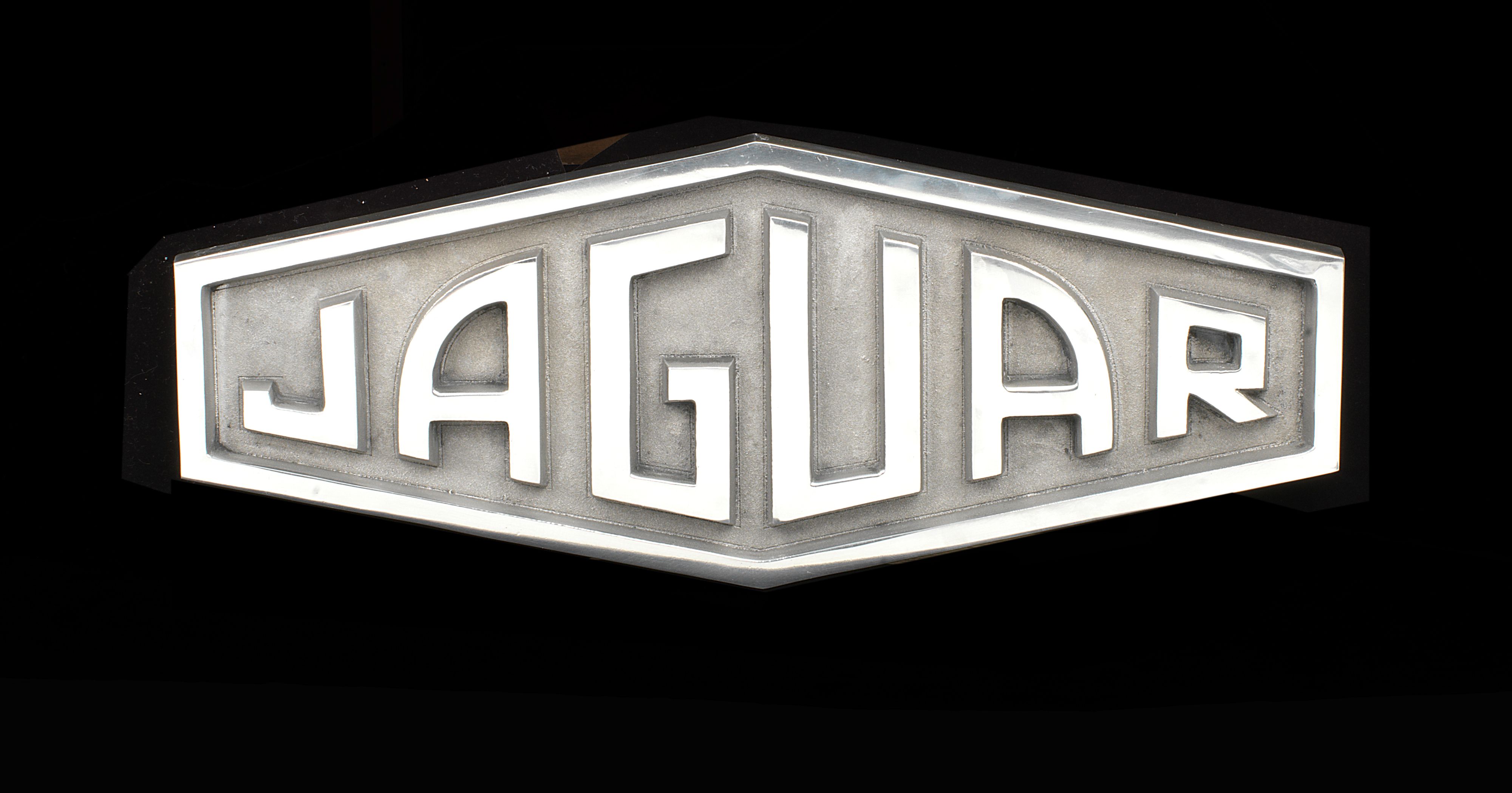 Bonhams Cars : A CAST ALUMINIUM SIGN DEPICTING THE 1961-1963 JAGUAR EMBLEM,