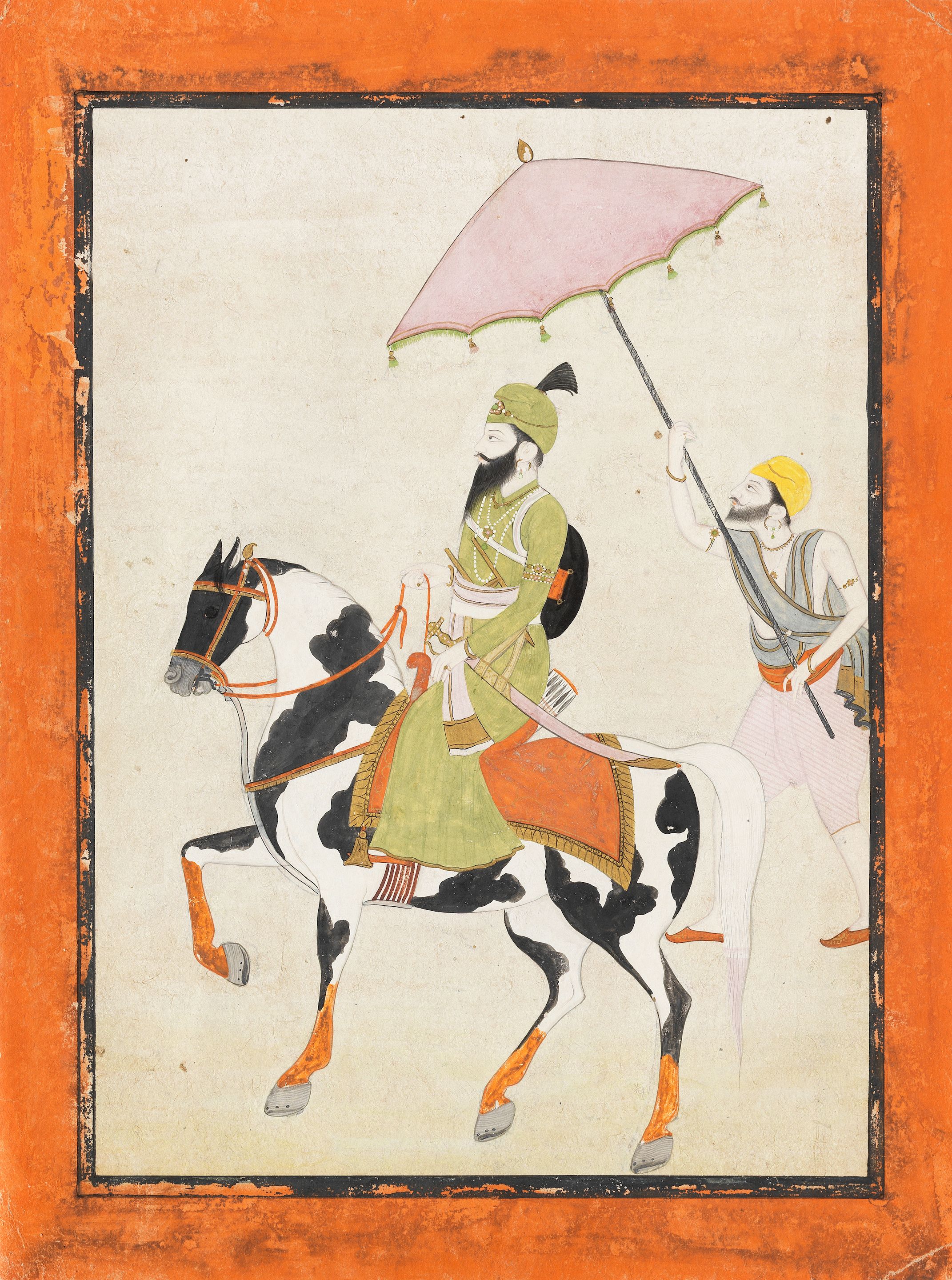 Bonhams : A Sikh nobleman riding a piebald horse, an attendant on foot ...