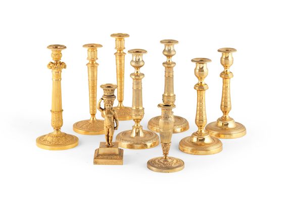 Bonhams : Three pairs of French 19th century gilt-bronze candlesticks (9)