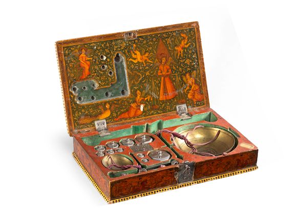 Bonhams : A Qajar lacquer box containing a set of portable merchant's ...