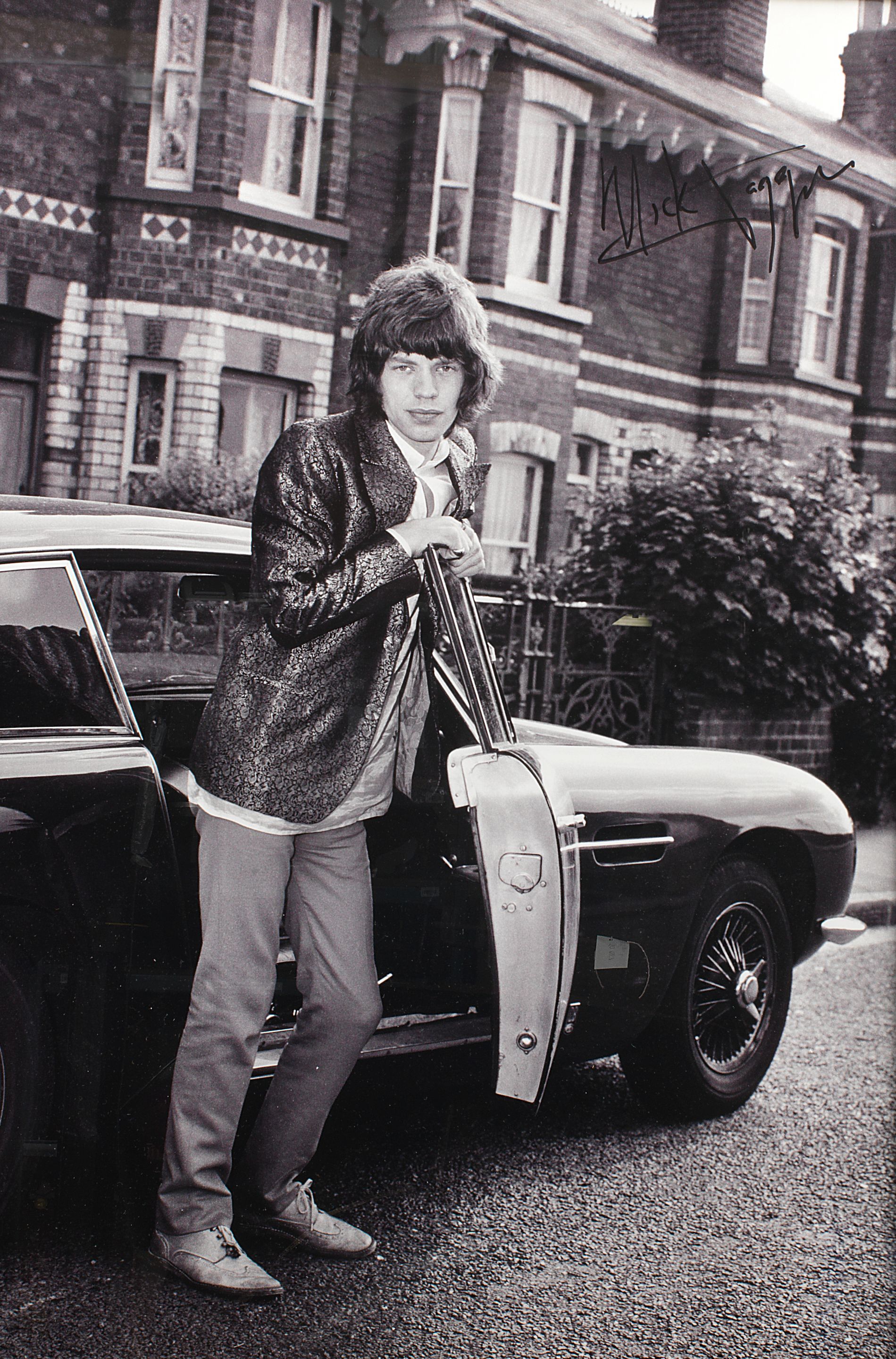 Bonhams Cars : A signed poster of Mick Jagger with his Aston Martin DB6,