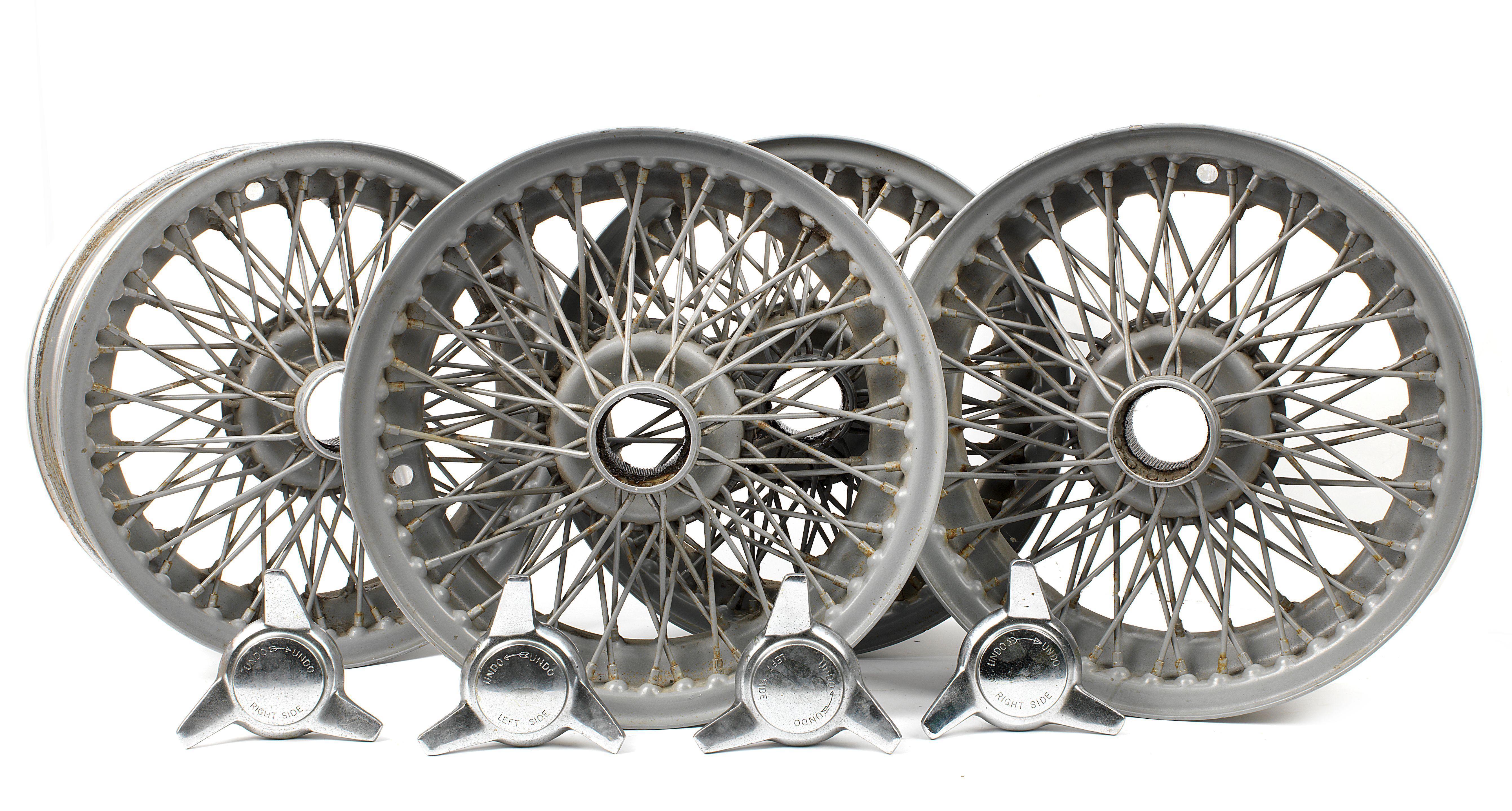 Bonhams Cars : A set of four Aston Martin DB4/DB5 wheel spinners and ...