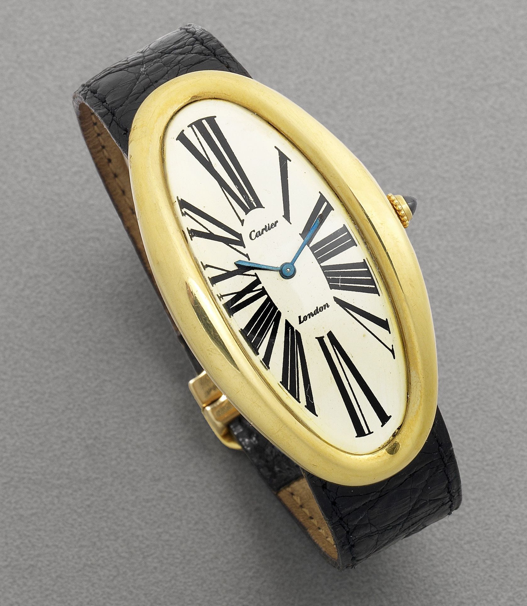 Bonhams : Cartier. A rare oversized 18K gold manual wind oval ...