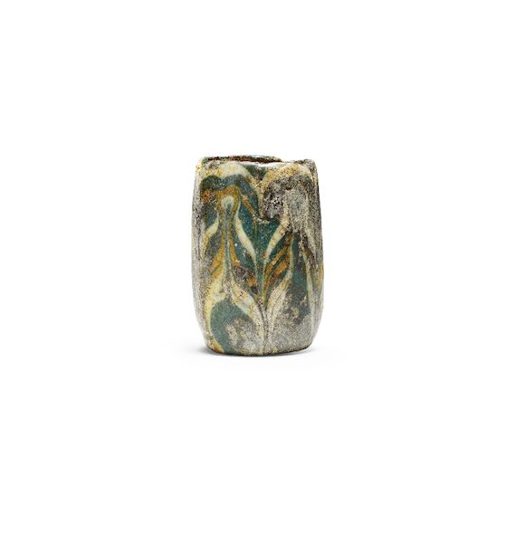 Bonhams : An Egyptian fragmentary core-formed glass vessel