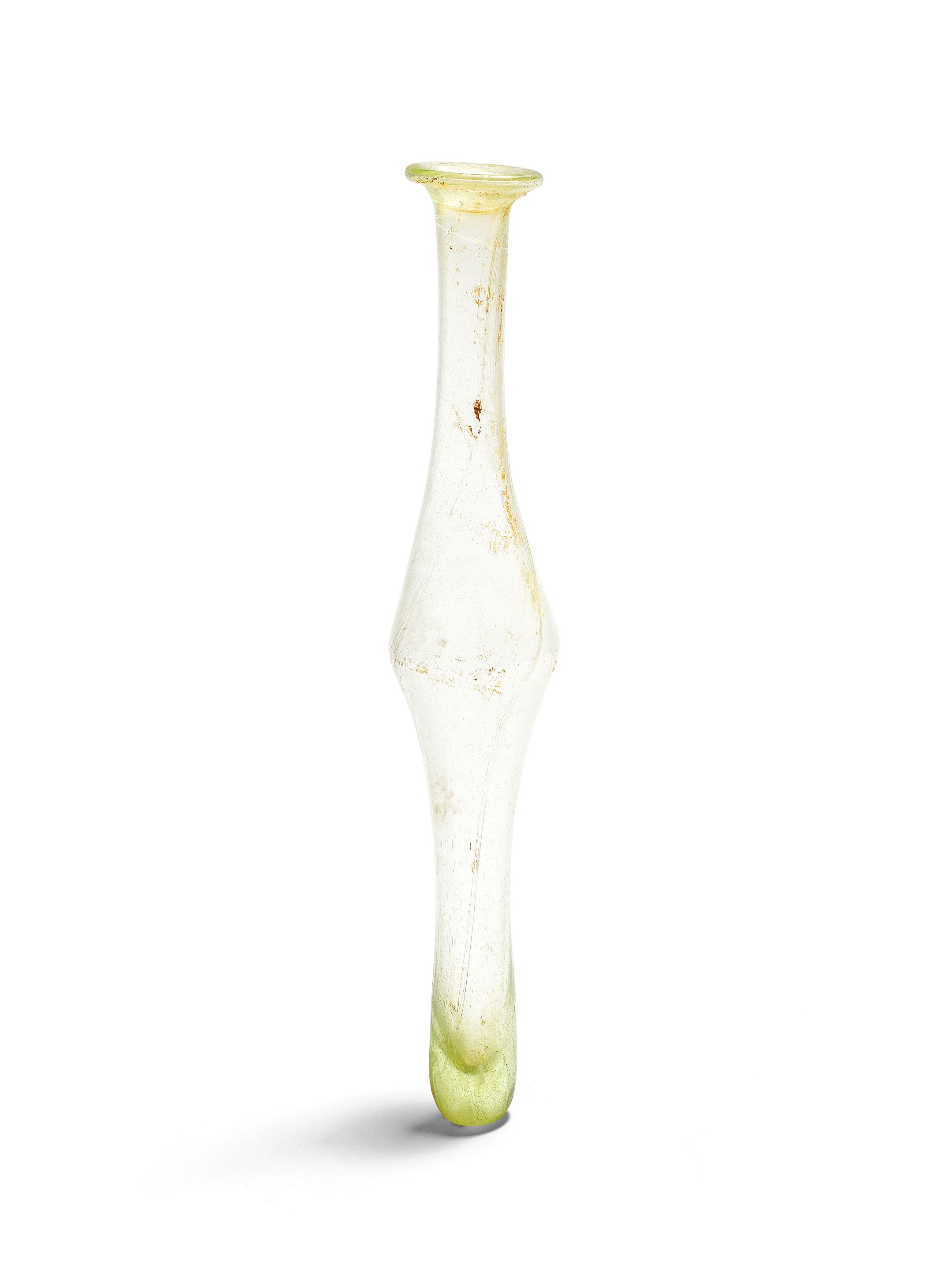 Bonhams : A Roman pale green glass tall unguentarium