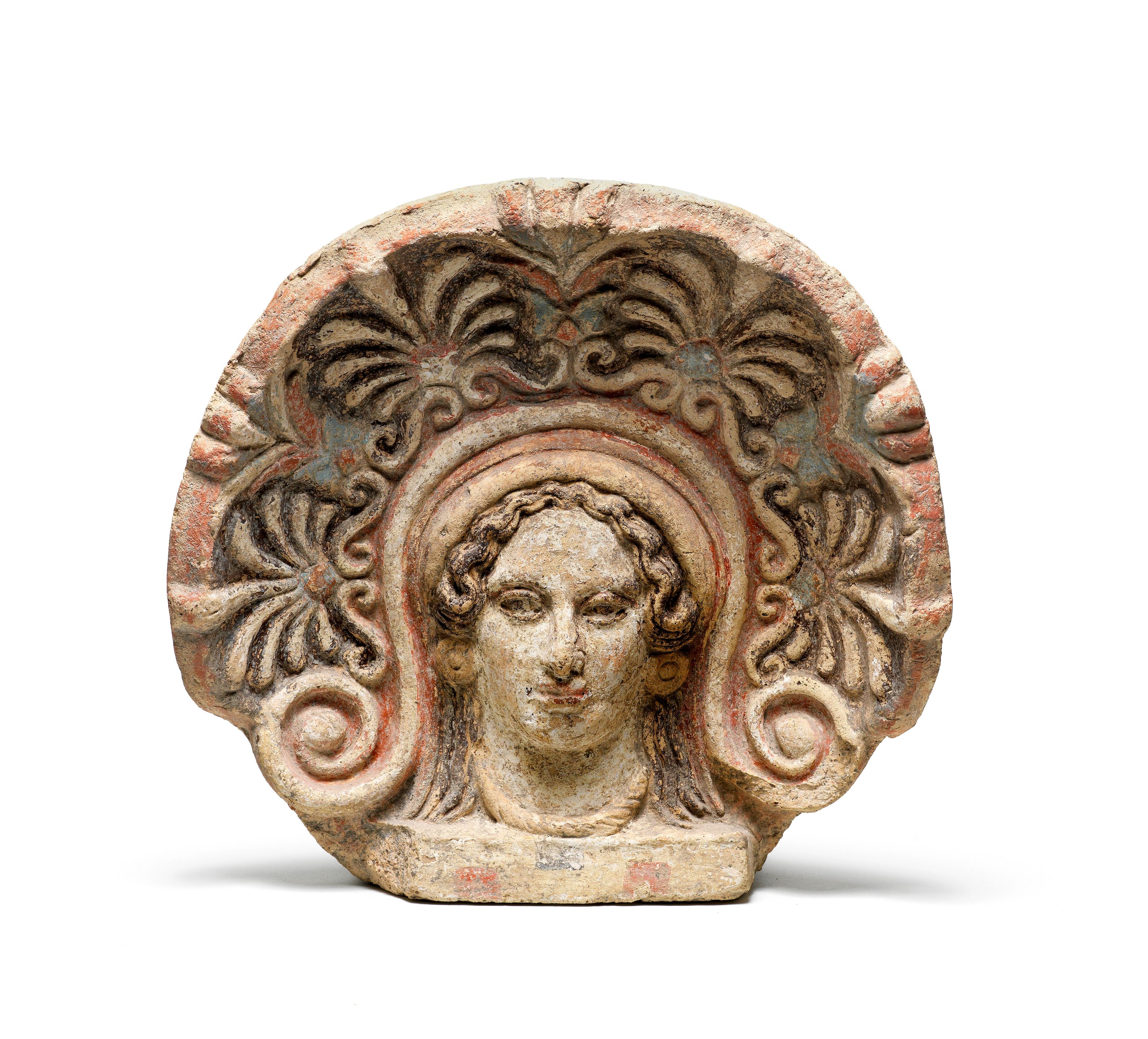 Bonhams : An Etruscan terracotta antefix with polychrome decoration