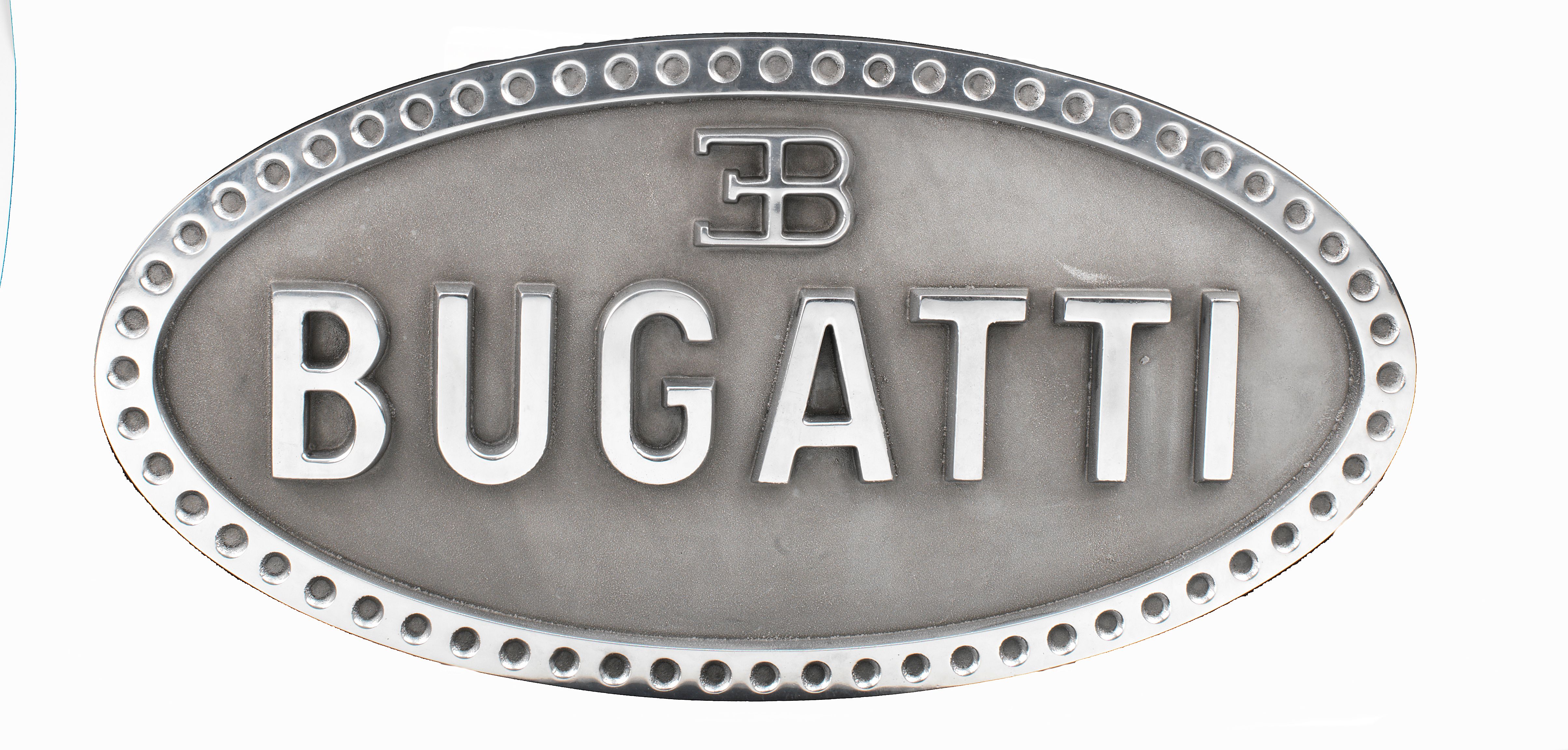 Bonhams Cars : A cast aluminium sign depicting the Bugatti oval badge,
