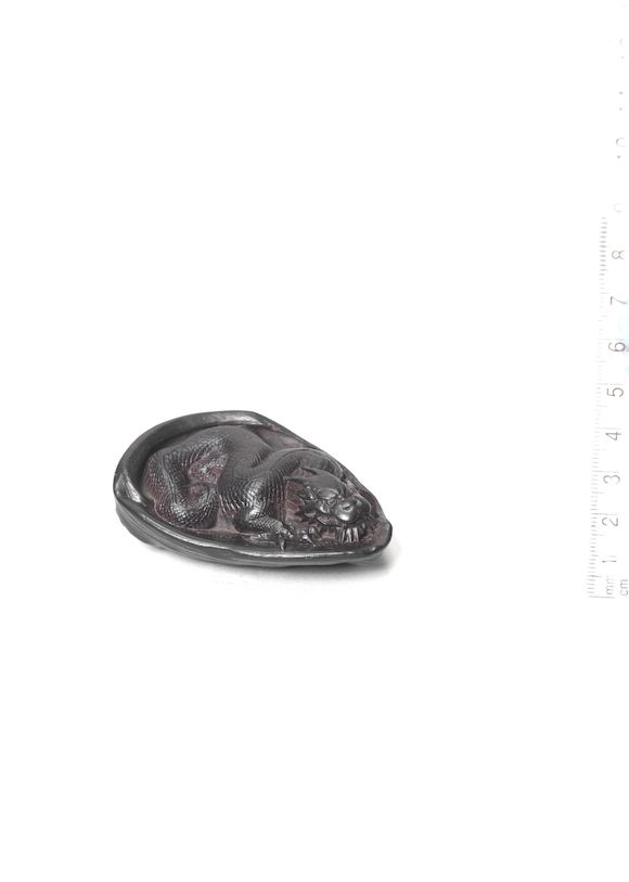 Bonhams : An ebony netsuke of a dragon in an awabi (abalone) shell Late ...