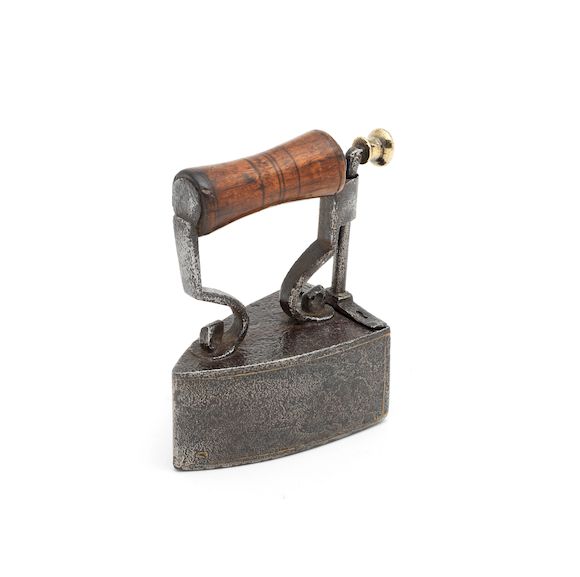 Bonhams : A very small wrought iron box iron, British, circa 1740-50 (2)