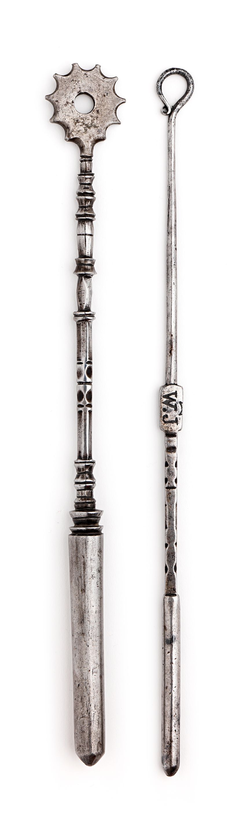 Bonhams : Two polished steel poking sticks, British (2)