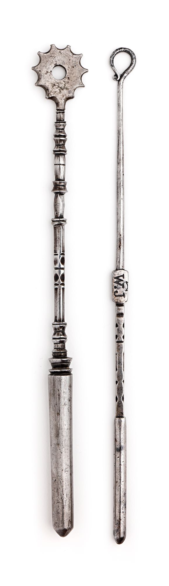 Bonhams : Two polished steel poking sticks, British (2)