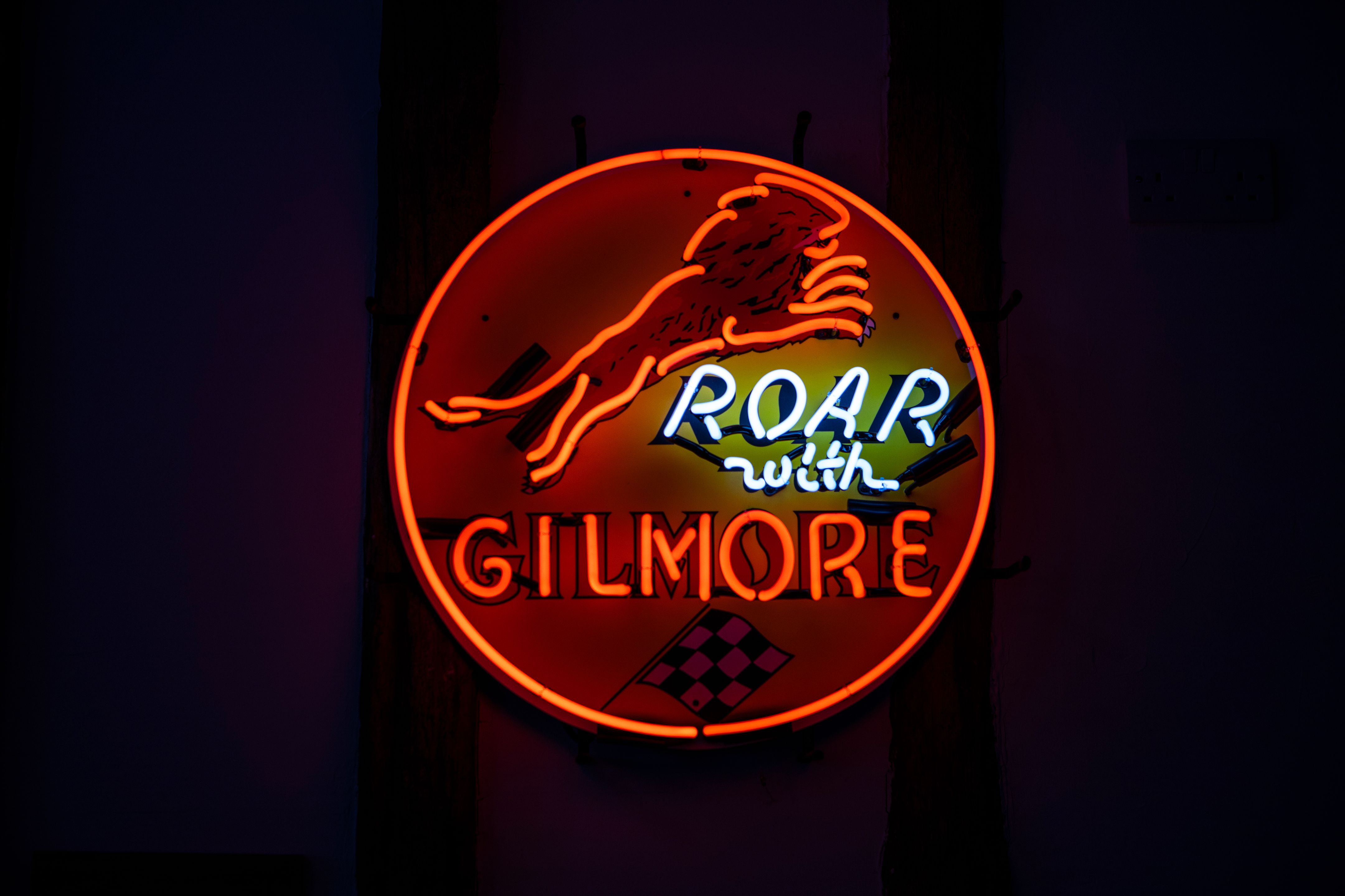 Bonhams Cars : A Roar with Gilmore neon sign