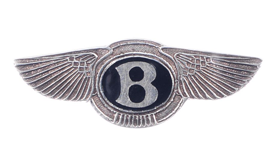 Bonhams Cars : A Sterling silver and enamel Bentley Winged B lapel ...