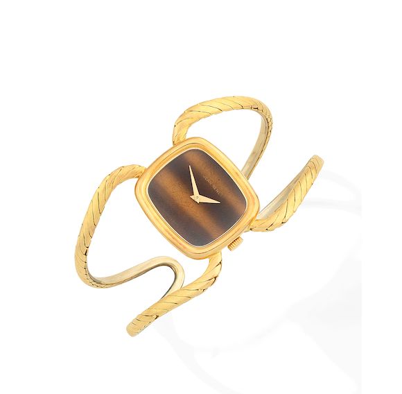 Bonhams : A gold and enamel watch/bangle, by Baume & Mercier for Jean ...