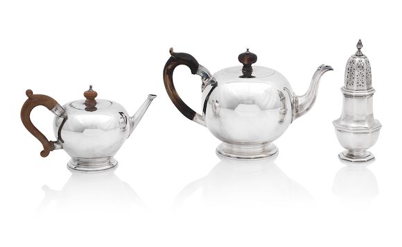 Bonhams : Two bullet style modern silver teapots, and a sugar caster ...