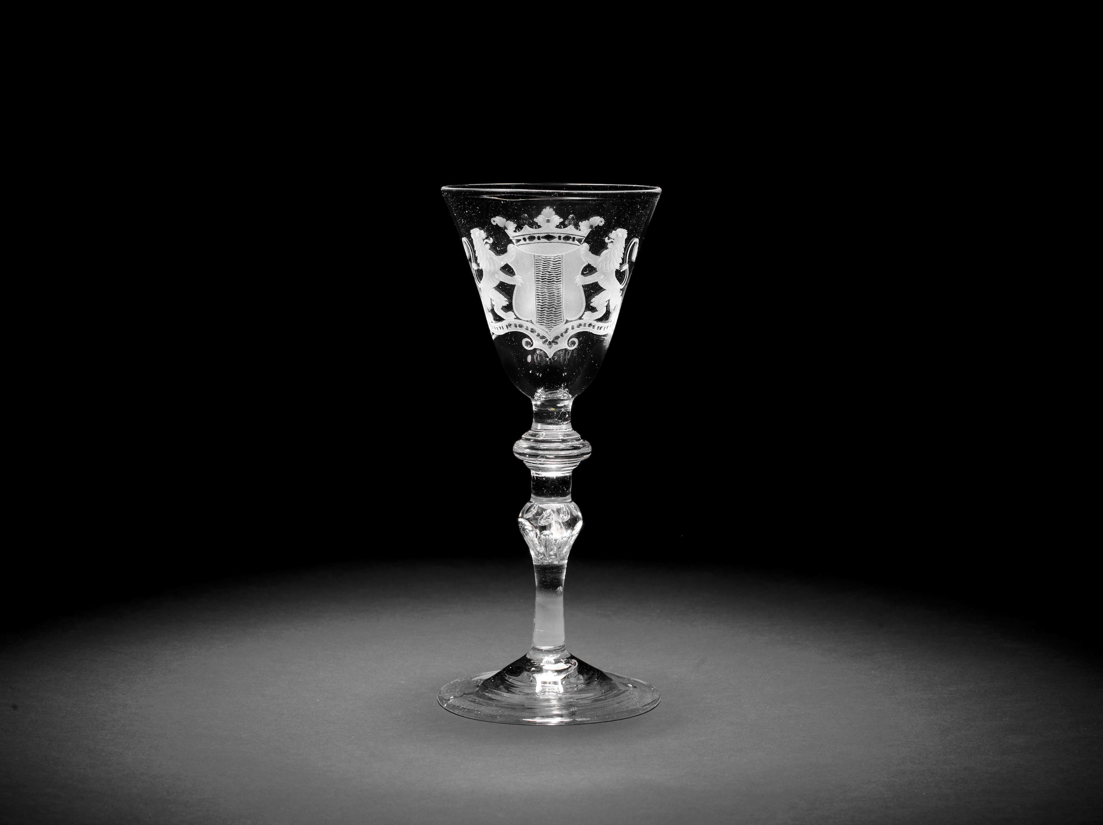 Bonhams A Dutch Engraved Armorial Light Baluster Wine Glass Circa