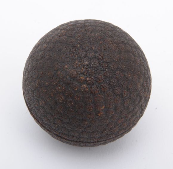 Bonhams : Tom Morris black rubber core bramble pattern golf ball