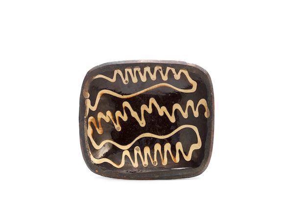 Bonhams : A large slipware dish, 18th century