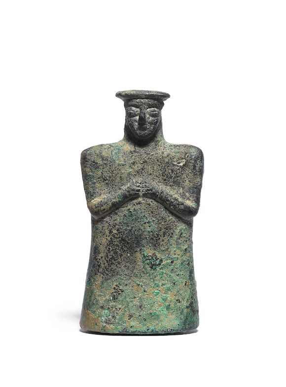 Bonhams : An Elamite bronze kohl pot in the form of a worshipper