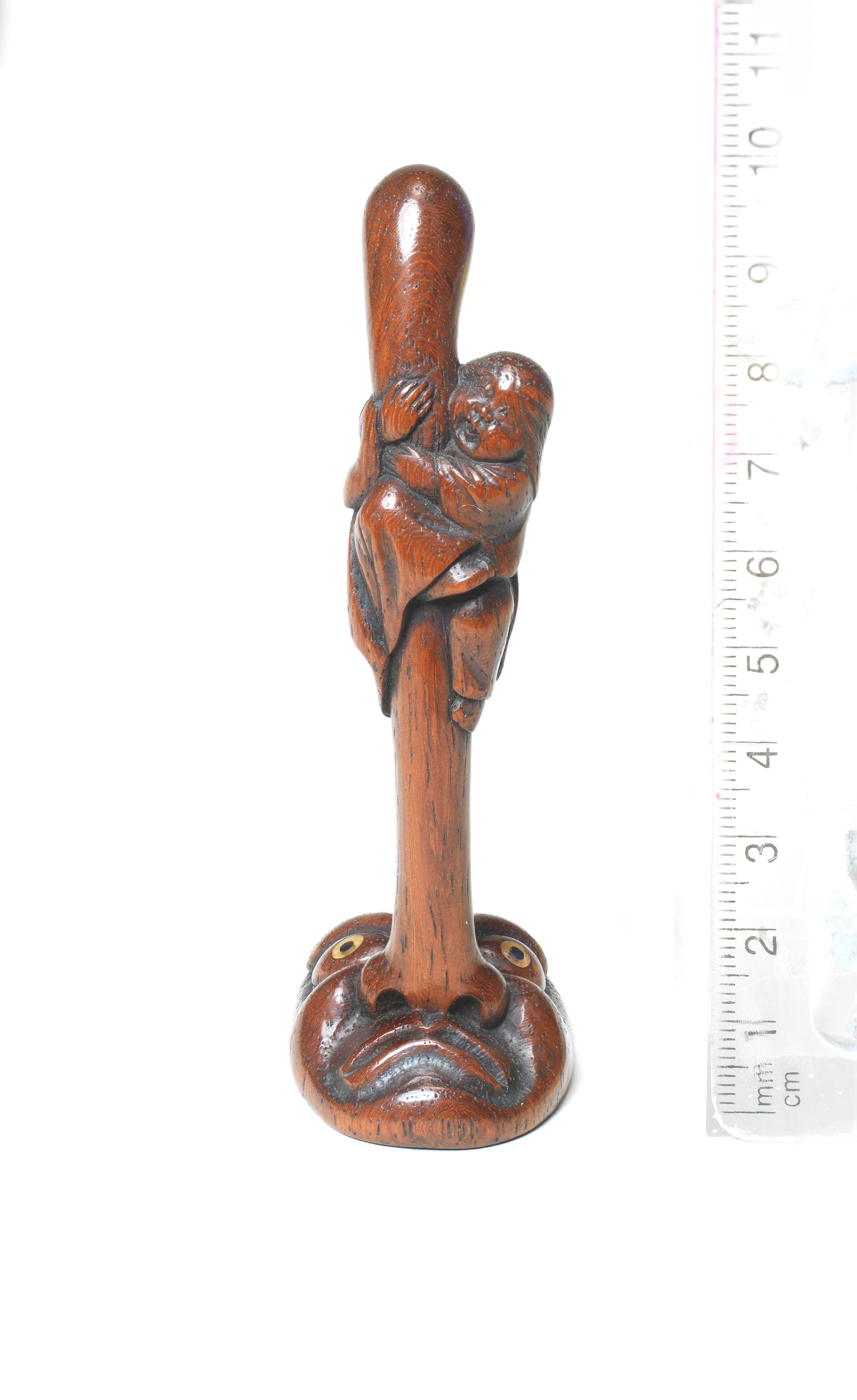 Bonhams : A wood netsuke of Okame on a long-nosed tengu mask Late 19th ...