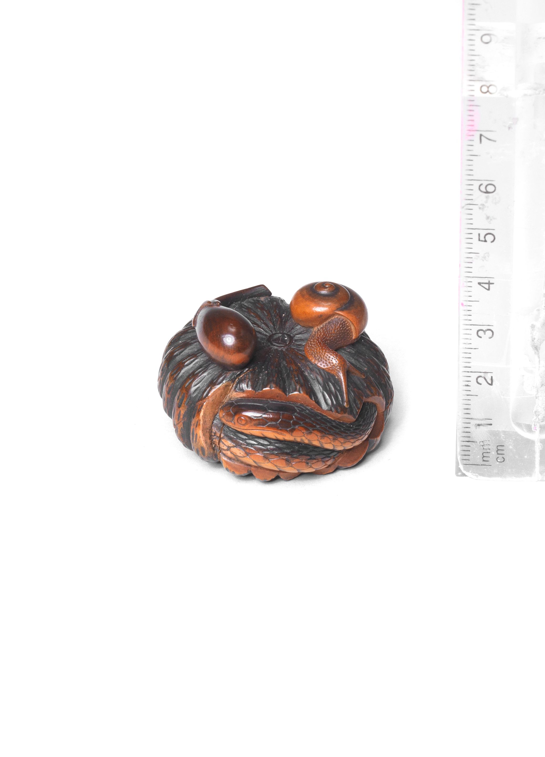 Bonhams : A wood netsuke of a snake and snail By Shigemasa, Nagoya ...