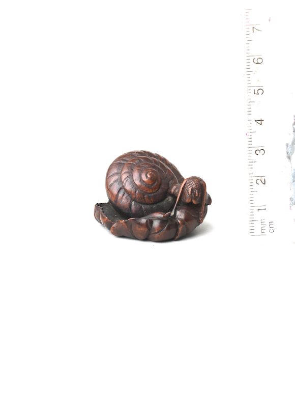 Bonhams : A wood netsuke of a snail By Sari, Iwashiro Province, early ...