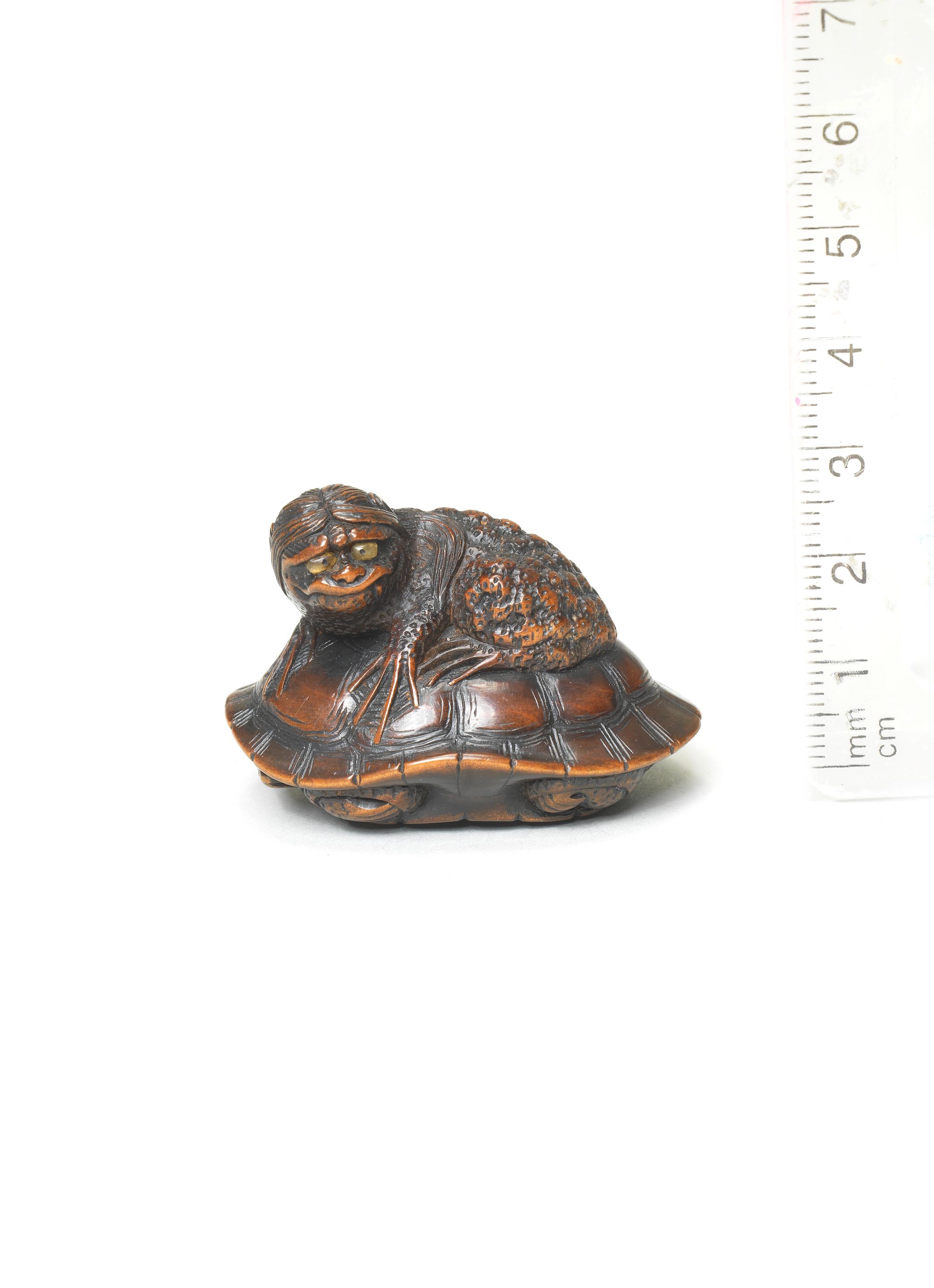 Bonhams : A wood netsuke of a kappa on a tortoise By Naito Toyomasa ...