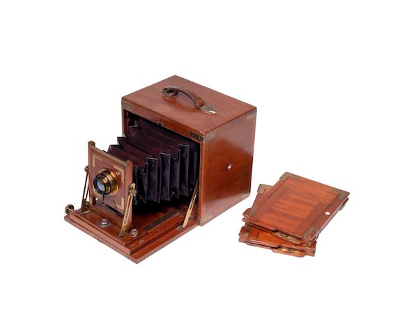 Bonhams : A Half-Plate Mahogany and Brass Bound Hand Stand Camera,