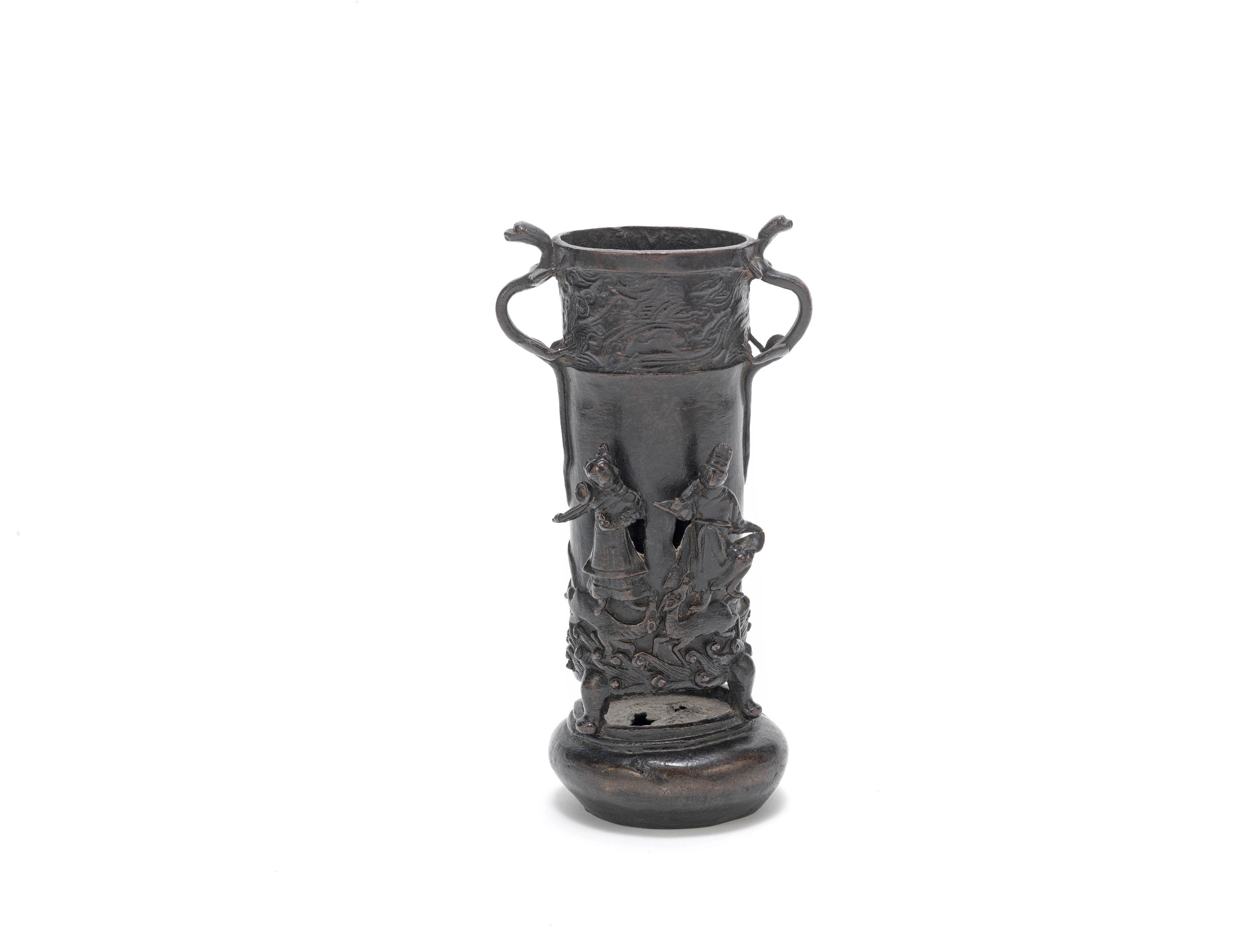 Bonhams : A bronze reticulated cylindrical vessel with integrated stand ...