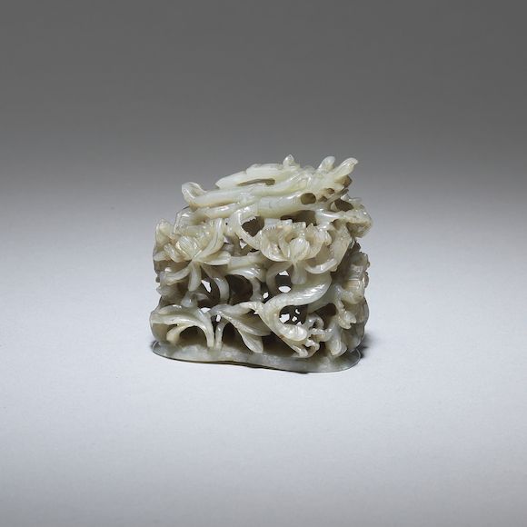 Bonhams : A green jade 'dragon and lotus' hat finial Ming Dynasty