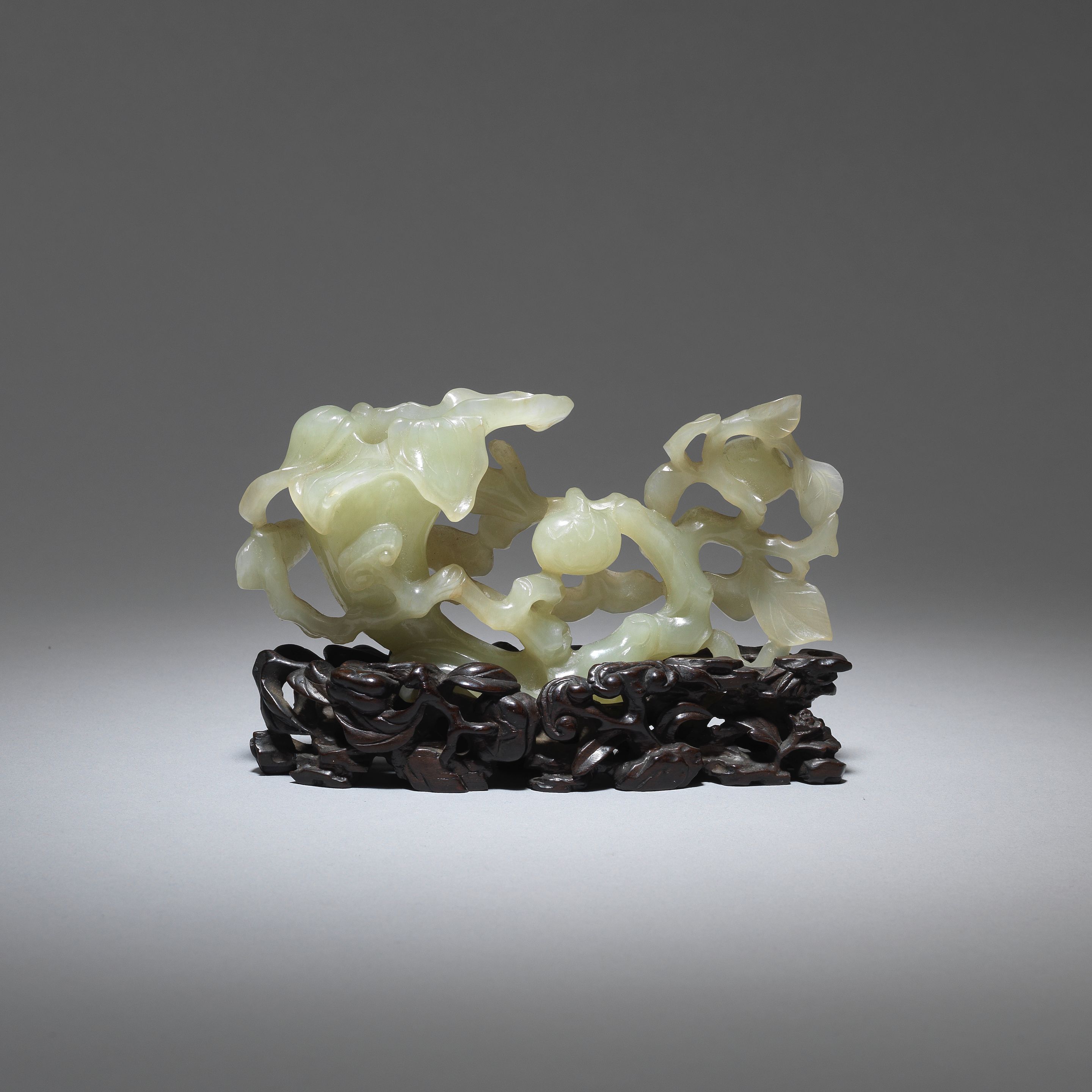 Bonhams : A pale green jade 'magnolia, melon and lingzhi' reticulated ...