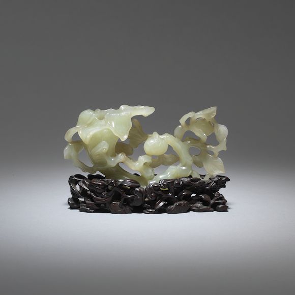 Bonhams : A pale green jade 'magnolia, melon and lingzhi' reticulated ...