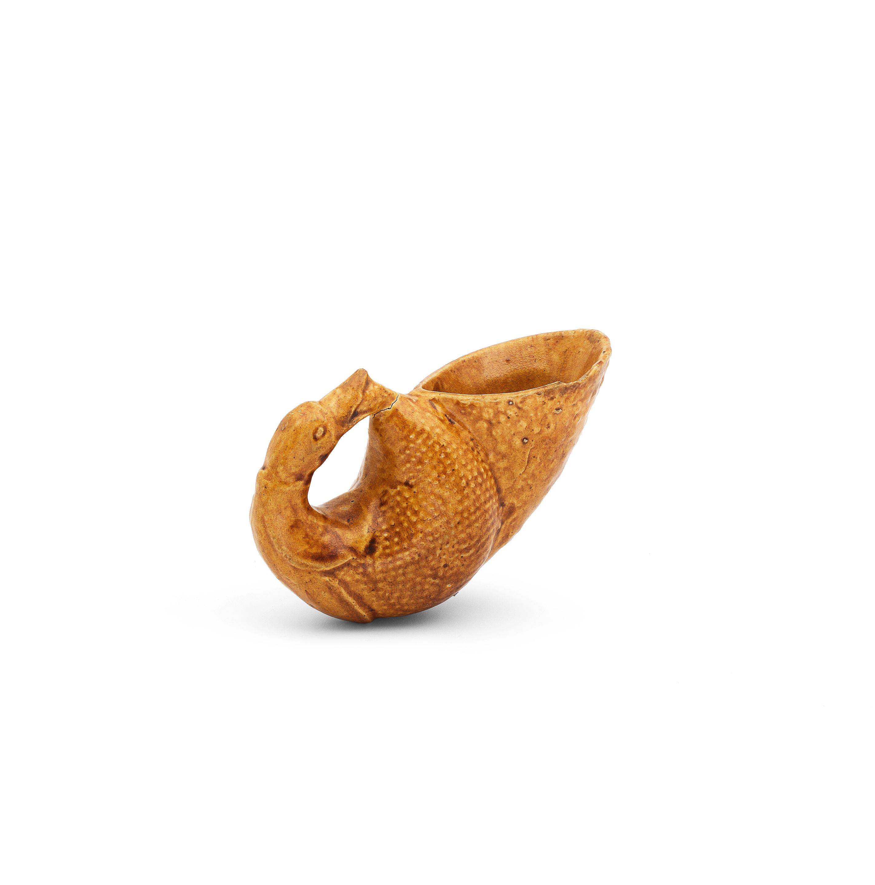 Bonhams : AN UNUSUAL AMBER-GLAZED POTTERY 'DUCK' RHYTON CUP Tang Dynasty