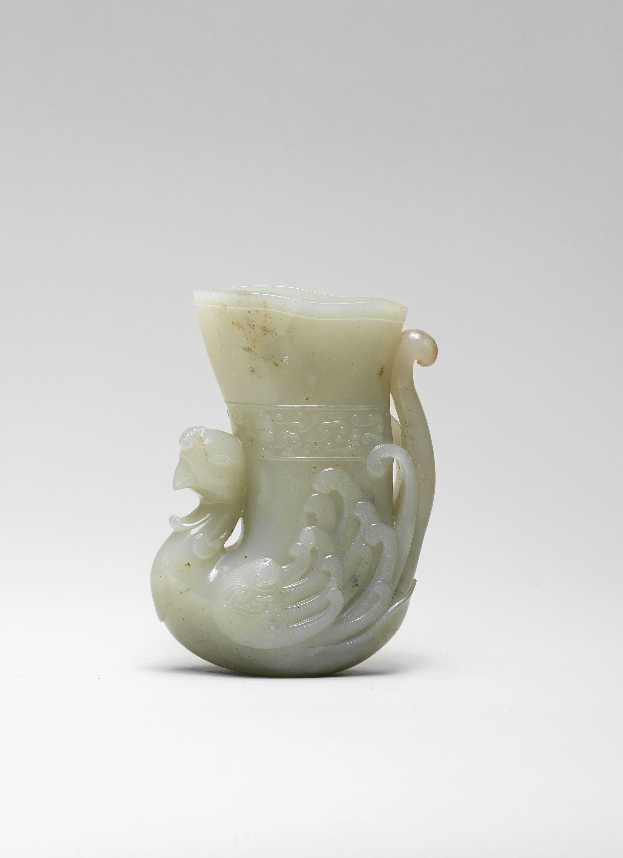 Bonhams : A PALE GREEN JADE 'PHOENIX' RHYTON CUP 17th/18th century