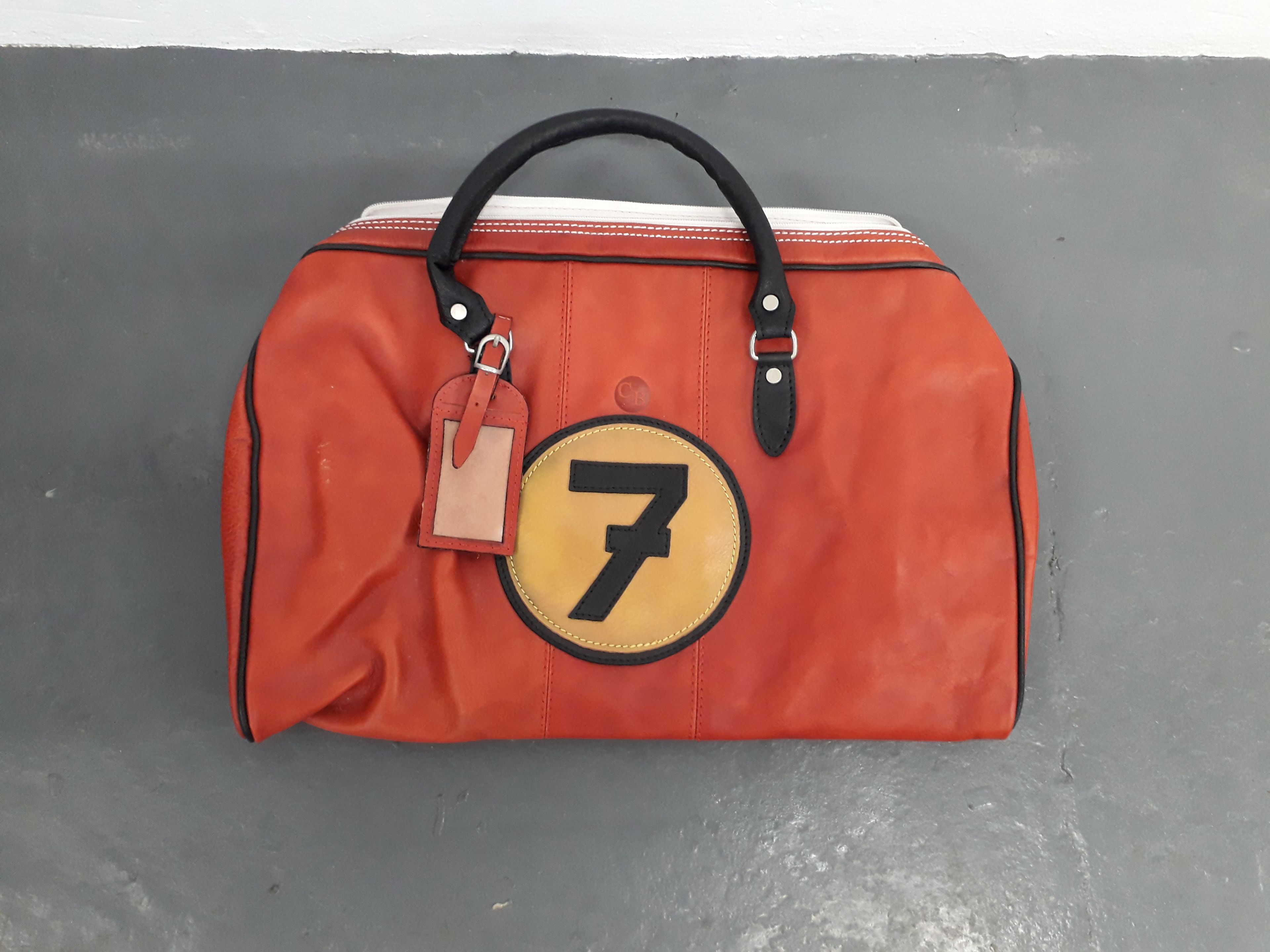 Bonhams Cars : A leather holdall bag