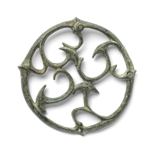 Bonhams : A large Romano-Celtic bronze trumpet whorl roundel