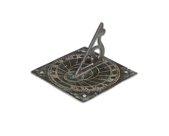 Bonhams : A small bronze sundial plate, probably for use on a window sill