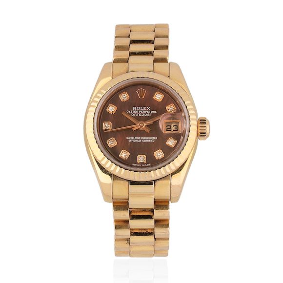 Bonhams : Rolex. A lady's 18K gold and diamond set automatic calendar ...
